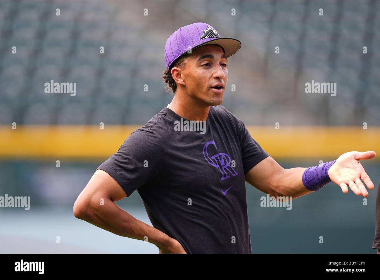 Colorado Rockies second baseman Ryan Ritter warms up before a baseball ...