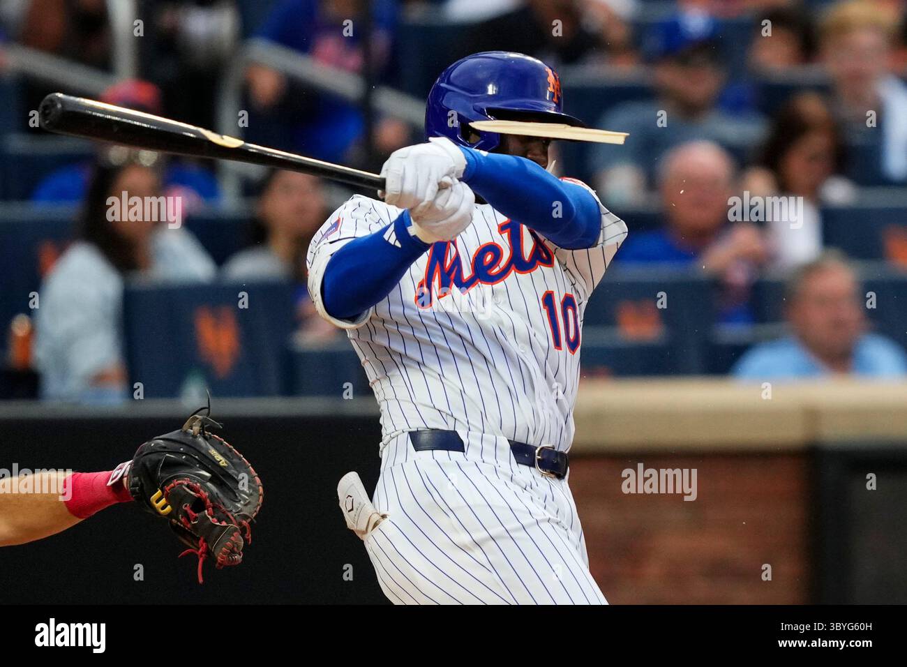 New York Mets' Ronny Mauricio breaks his bat as he grounds into a ...