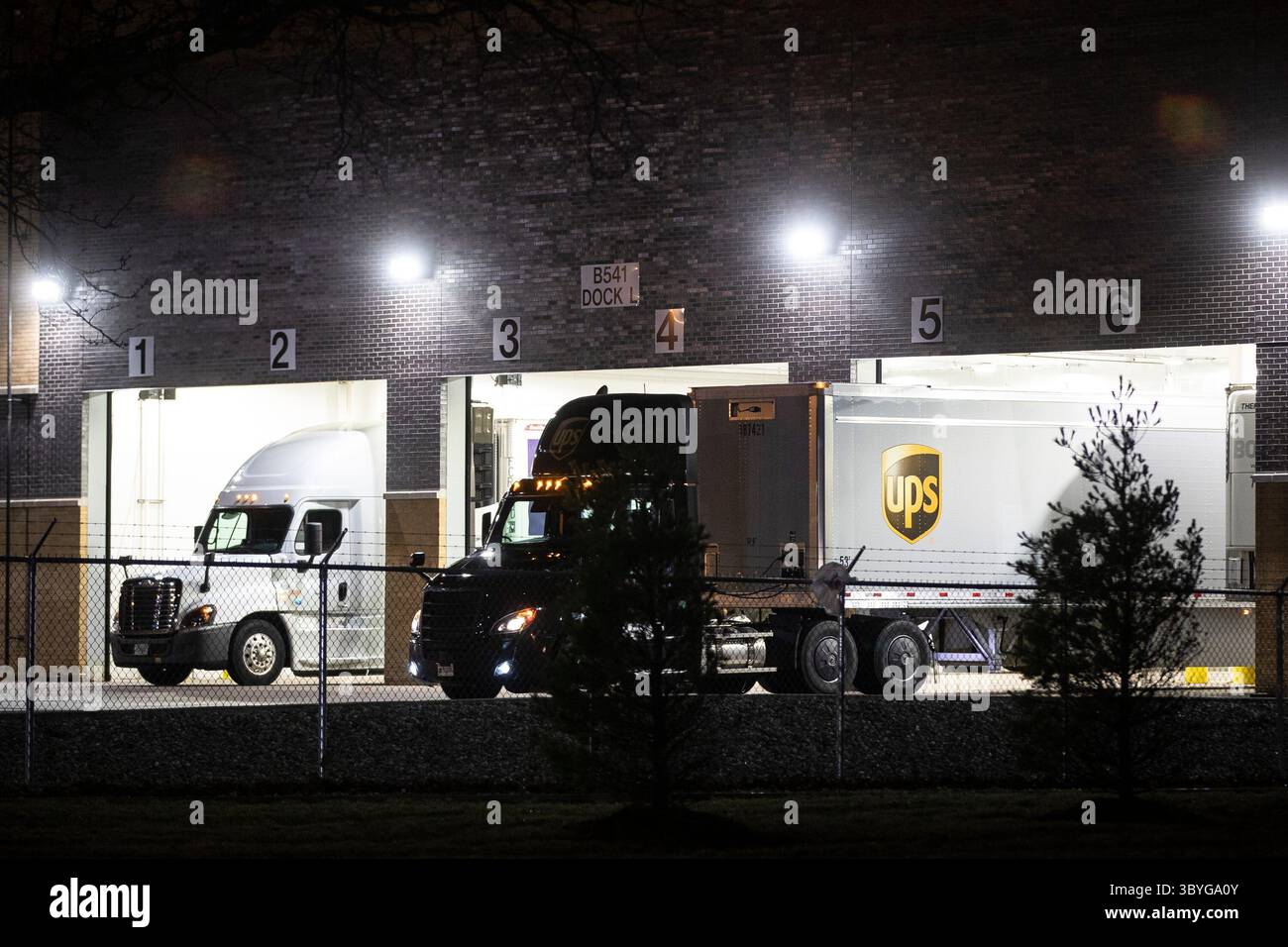 December 13, 2020, Portage, Michigan, USA: FedEx and UPS trucks back ...