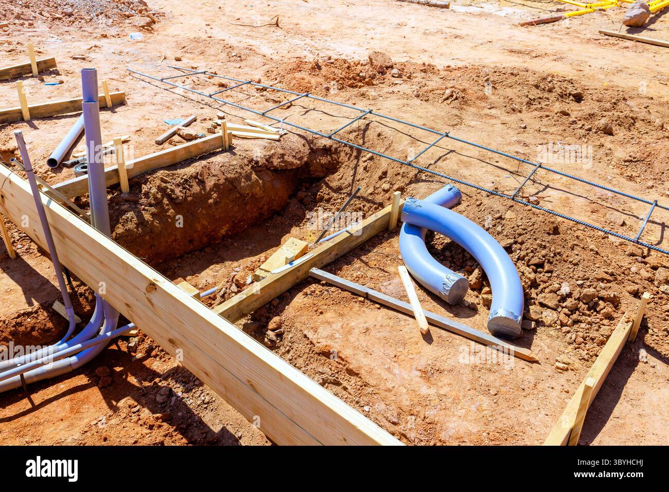Construction workers are installing plumbing pipes rebar framework at ...