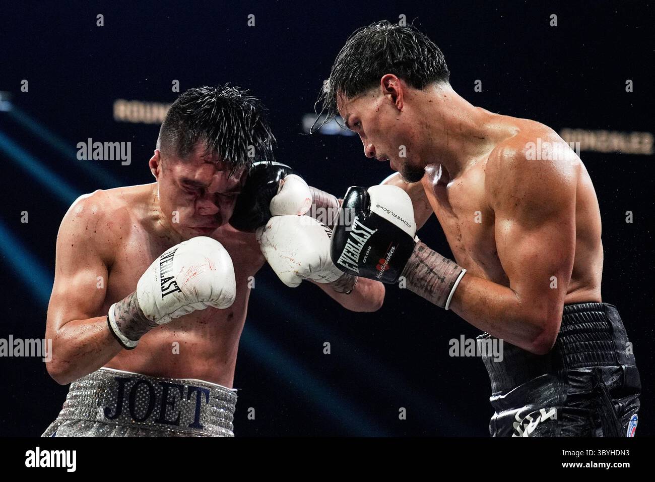 Joet Gonzalez, left, fights Brandon Figueroa in a featherweight boxing ...