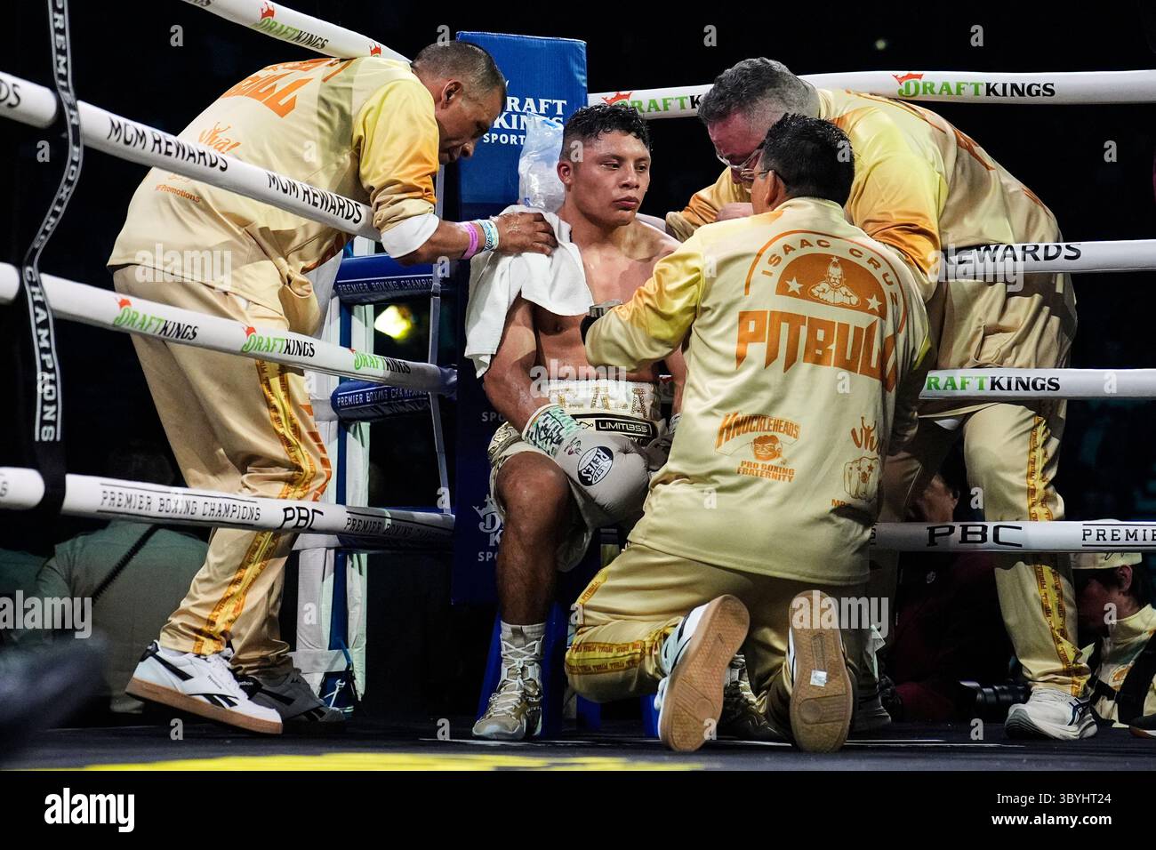 Isaac Cruz takes a break during a super lightweight boxing match ...