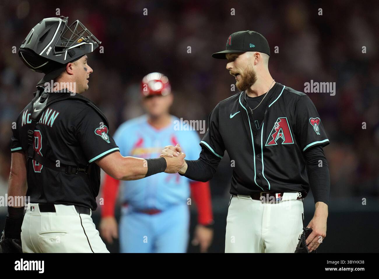 Arizona Diamondbacks pitcher Kyle Backhus, right, celebrates a win ...