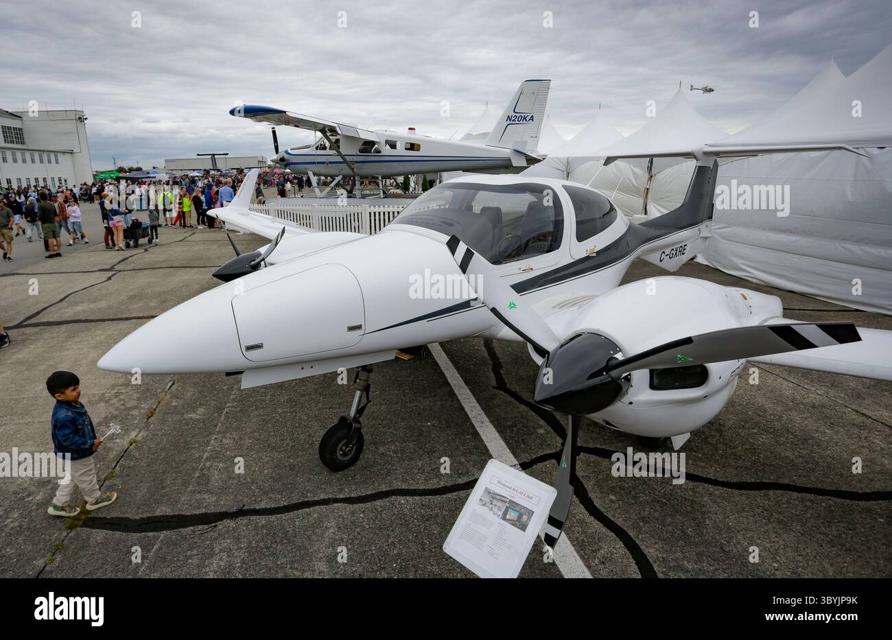 Delta, Canada. 19th July, 2025. A child takes a closer look at an aircraft on display at the ...