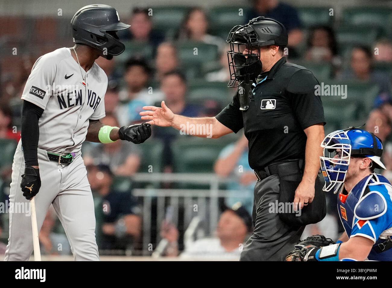New York Yankees second baseman Jazz Chisholm Jr. (13) speaks with an official in the sixth ...