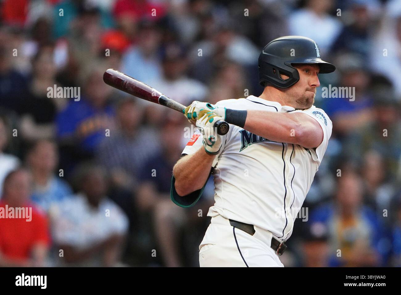 Seattle Mariners' Luke Raley follows through on an RBI single to score ...
