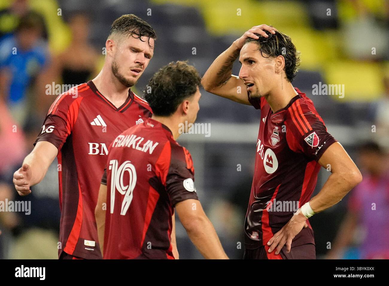 Toronto FC defender Kevin Long, left, midfielder Kobe Franklin (19) and ...