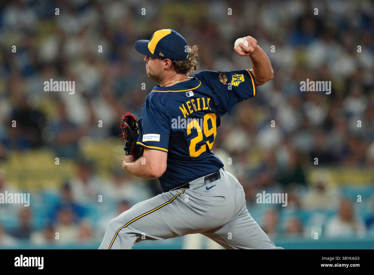 Milwaukee Brewers relief pitcher Trevor Megill throws to the plate ...