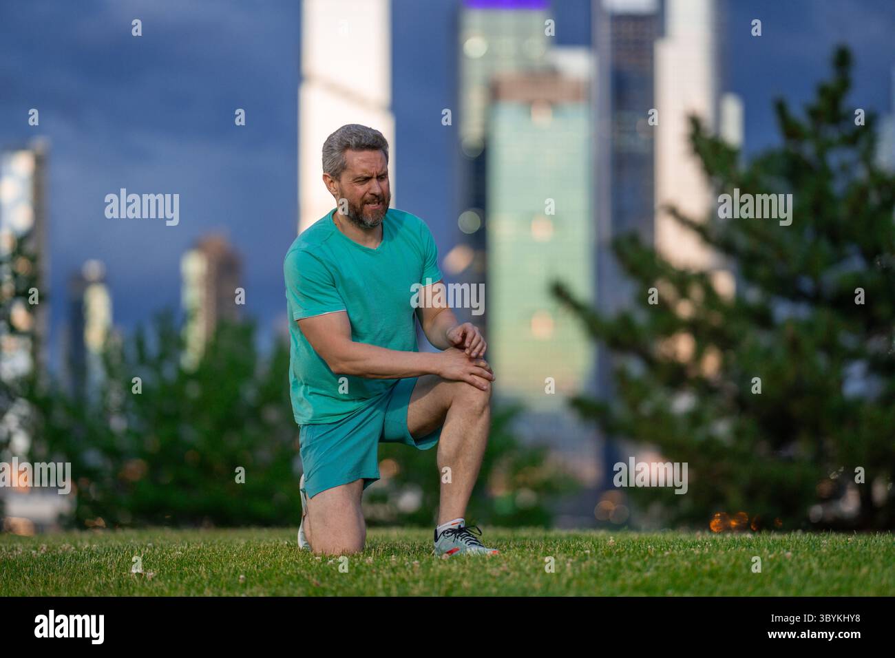 Knee after sport. Man struggling with leg pain. Injured man holding ...