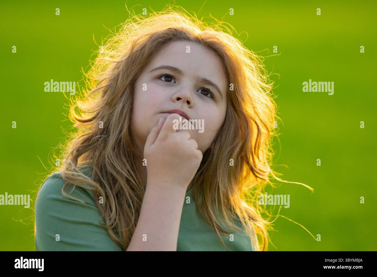 Kid looking away and thinking. Child dreamer thinking with a doubtful ...