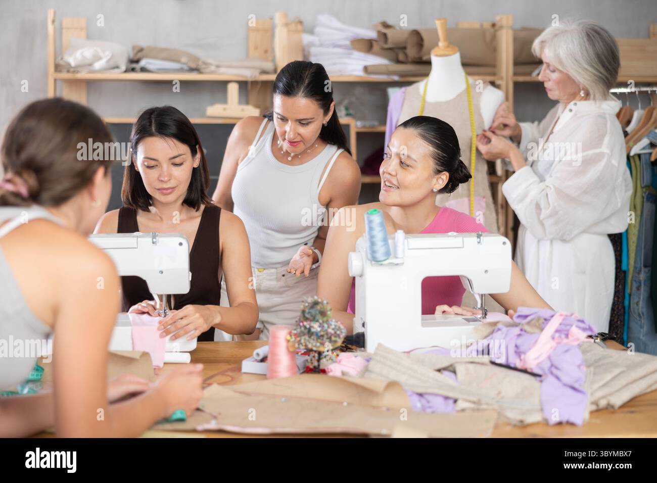 Women cutting dress pattern hi-res stock photography and images - Alamy
