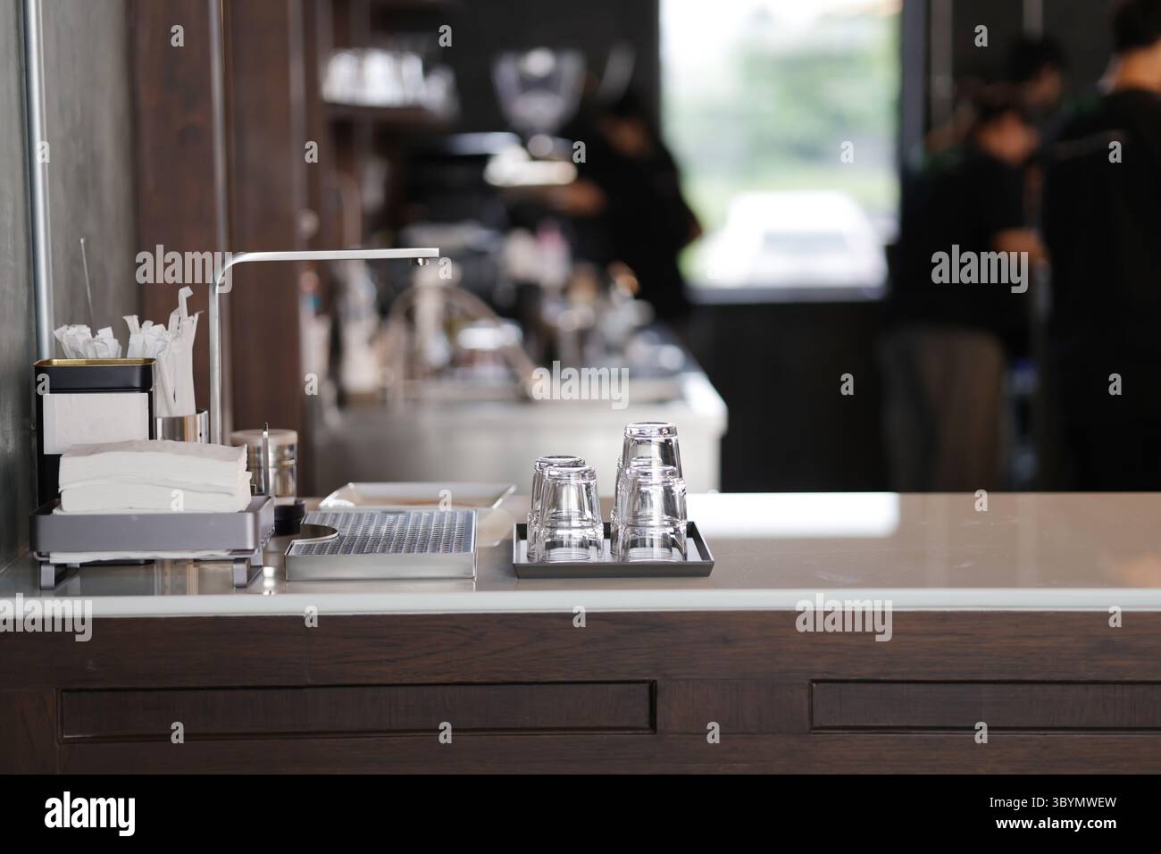 A small glass of water is placed upside down on the table. Clean ...