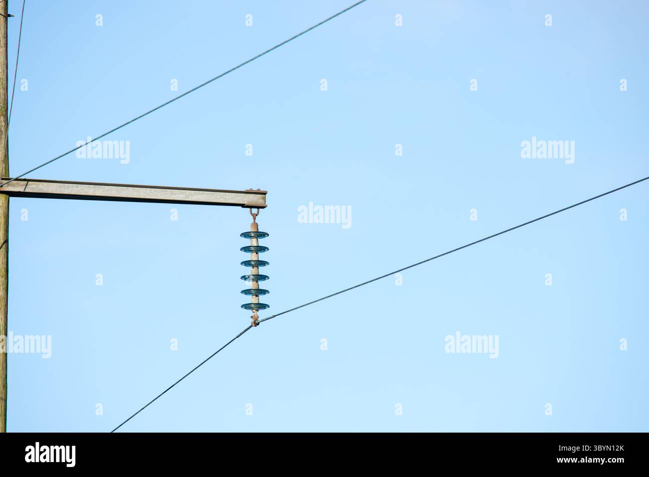 Old electricity pole against a clear blue sky, electricity poles in ...