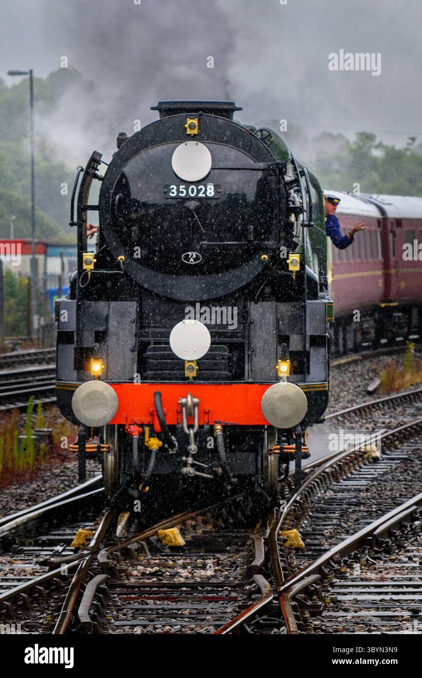 Steam engine 35028 operates at Yeovil Junction, surrounded by rain ...