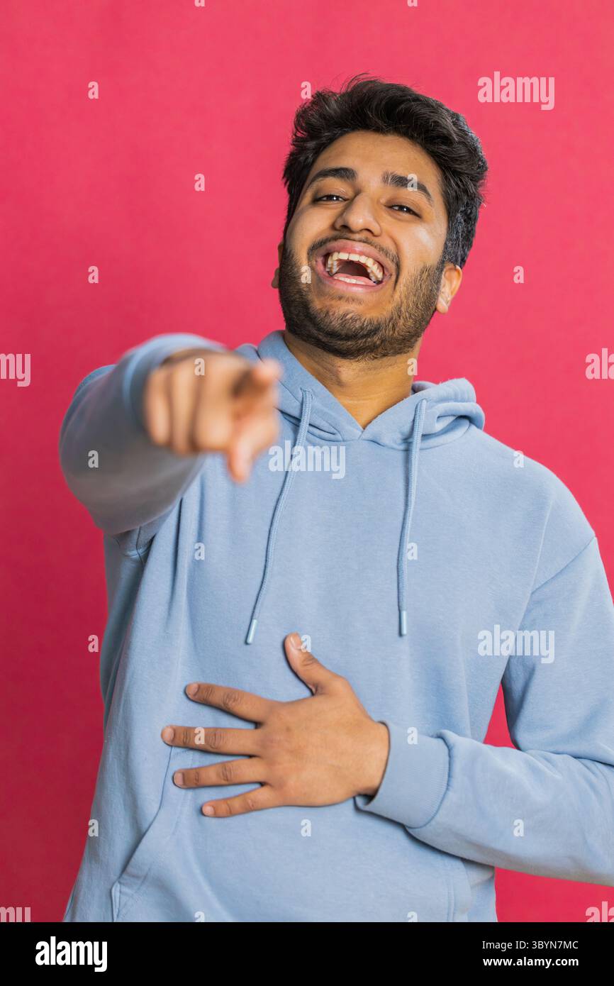 Happy Indian young man laughing out loud after hearing ridiculous ...