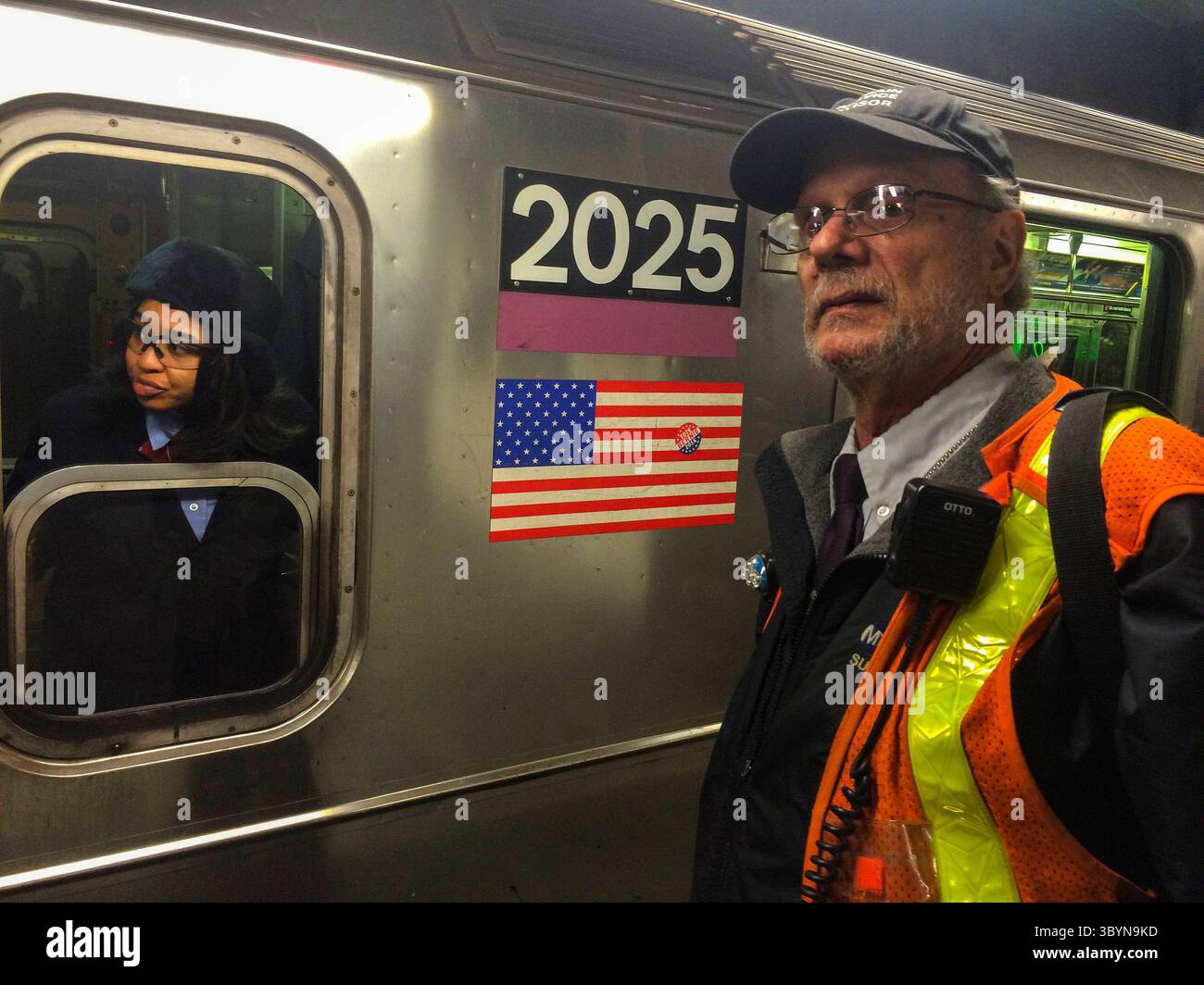 Helping a Colleague. New York City, USA. MTA Worker assisting a ...