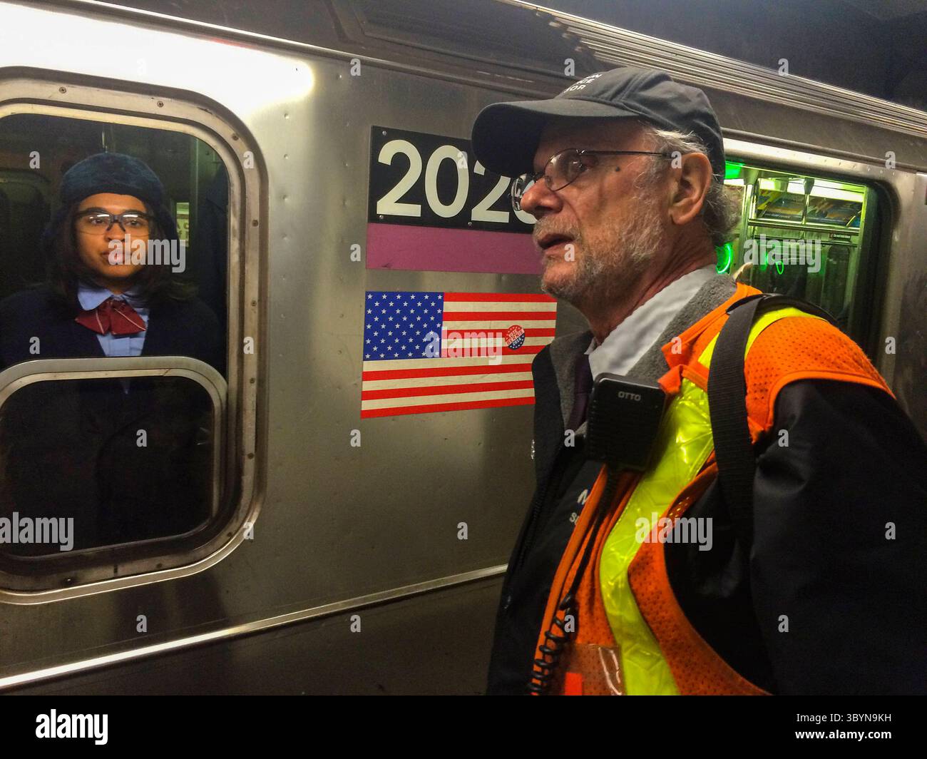 Helping a Colleague. New York City, USA. MTA Worker assisting a ...