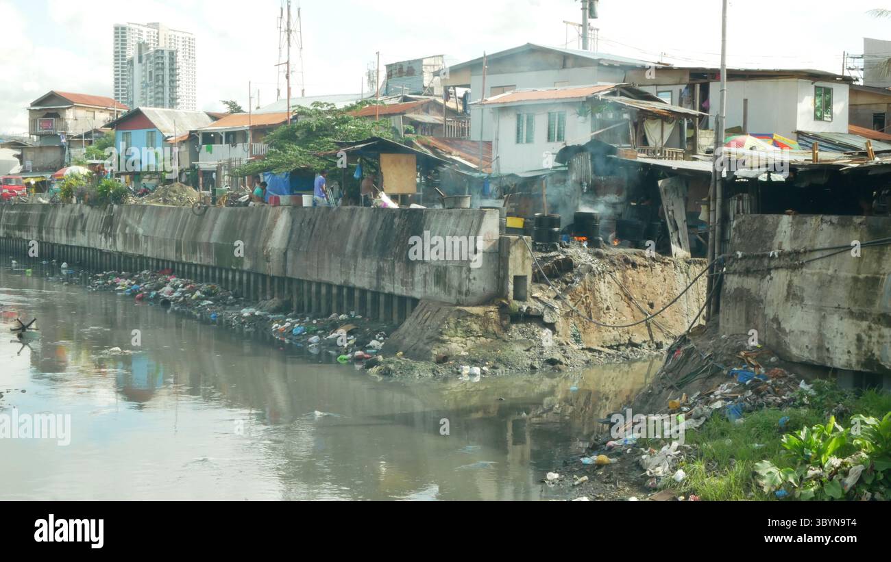 MANDAUE CITY, PHILIPPINES, JUNE 15, 2025: Philippine slum poor river ...