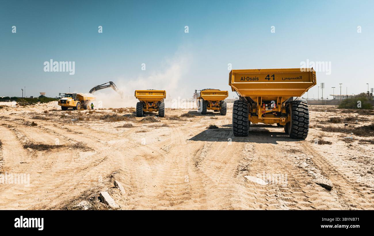 CAT Machines at the ARAMCO Stadium site in Al Khobar Stock Photo - Alamy