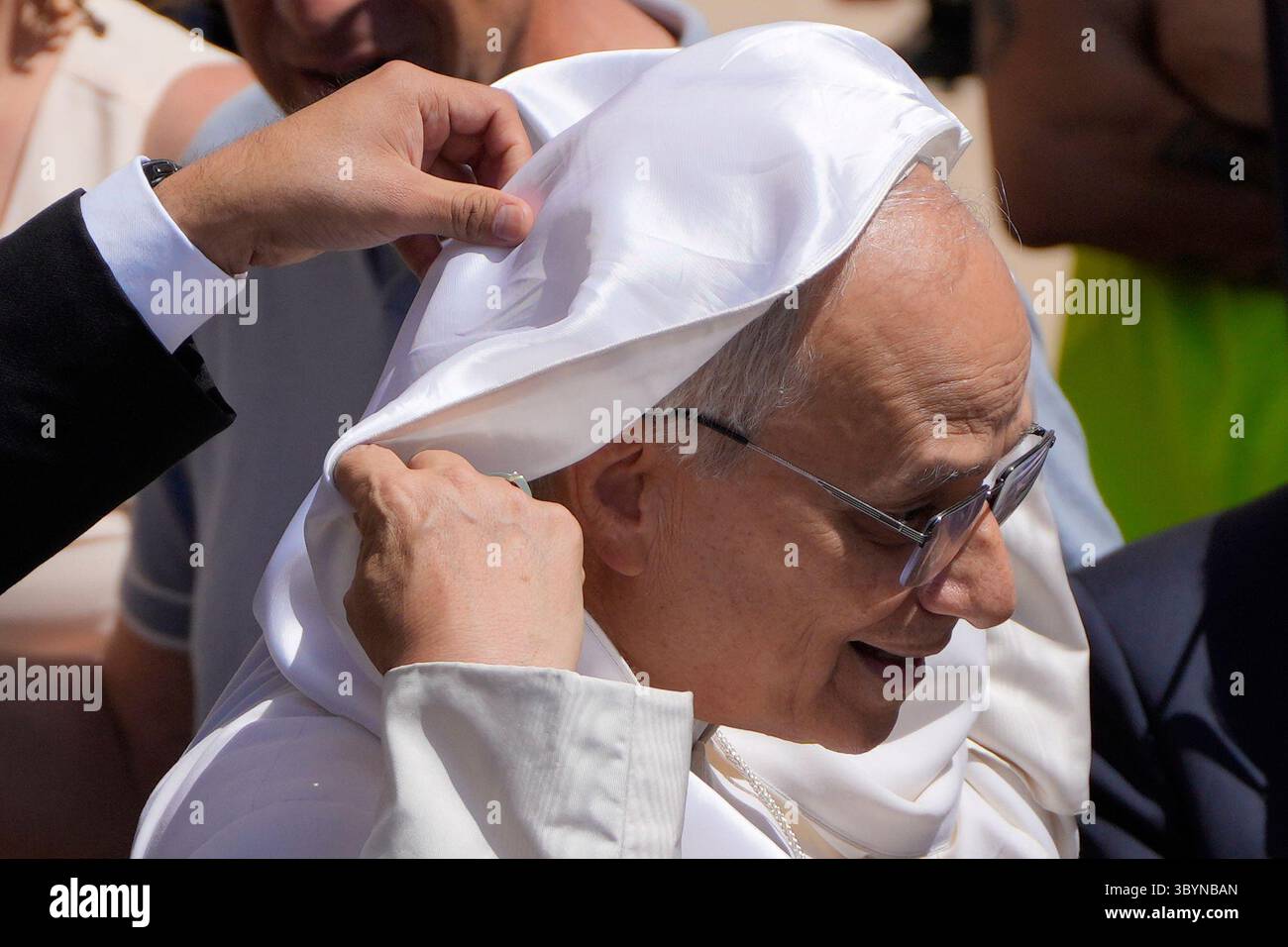 A gust of wind blows Pope Leo XIV's mantel at the end of the noon ...
