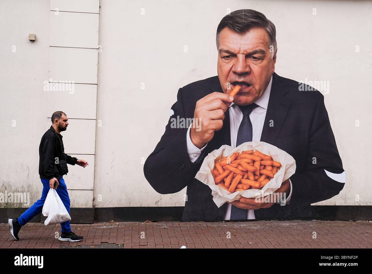 A mural of former England football manager Sam Allardyce eating orange ...