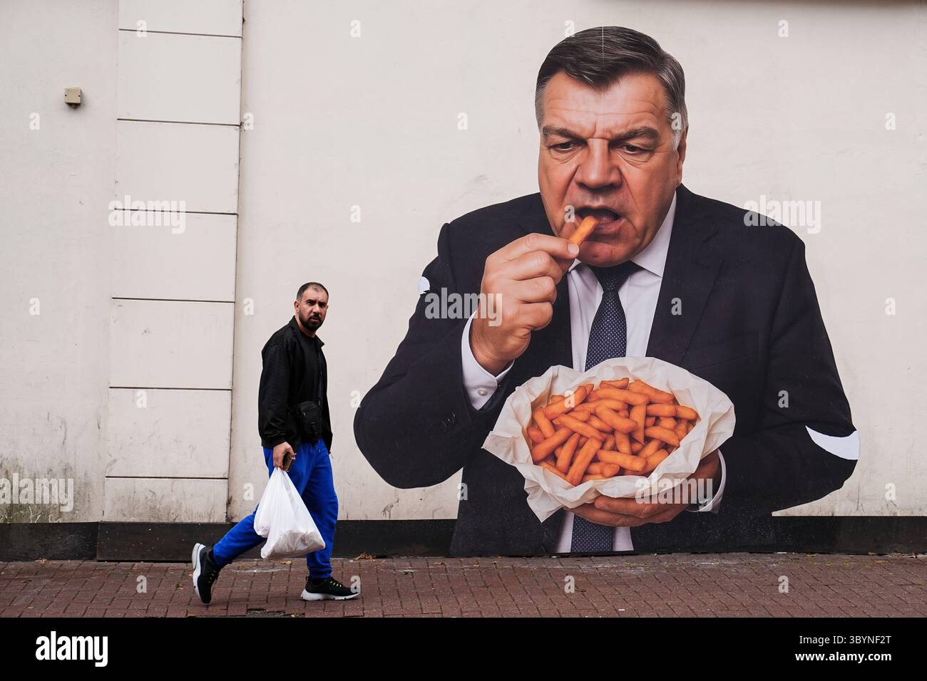 A mural of former England football manager Sam Allardyce eating orange ...