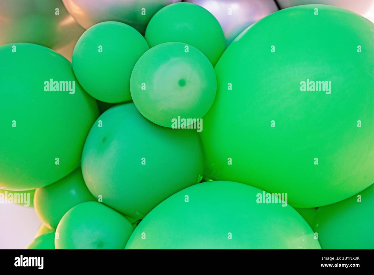 backdrop of green inflatable balloons for a children's party Stock ...