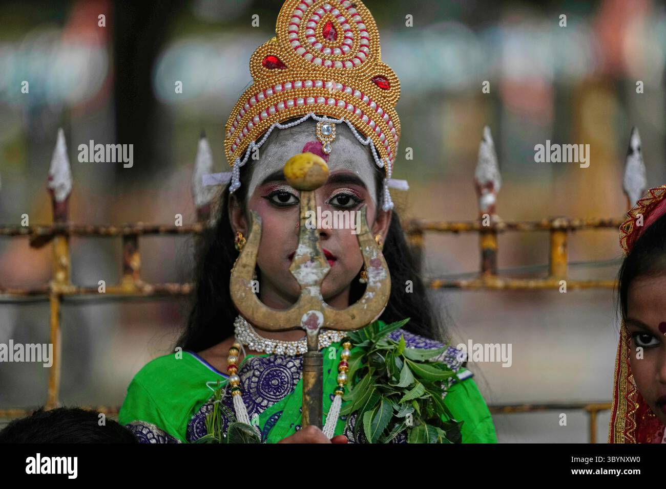 A devotee girl wearing hindu goddess Sheetla Mata attire as part of a ...