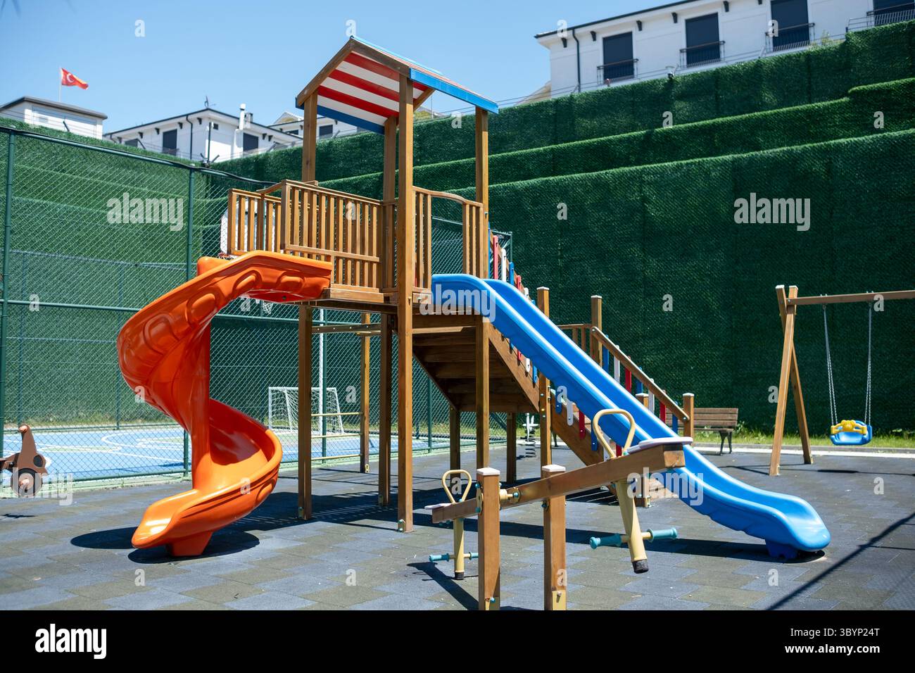 Brightly colored playground structures attract children for climbing ...
