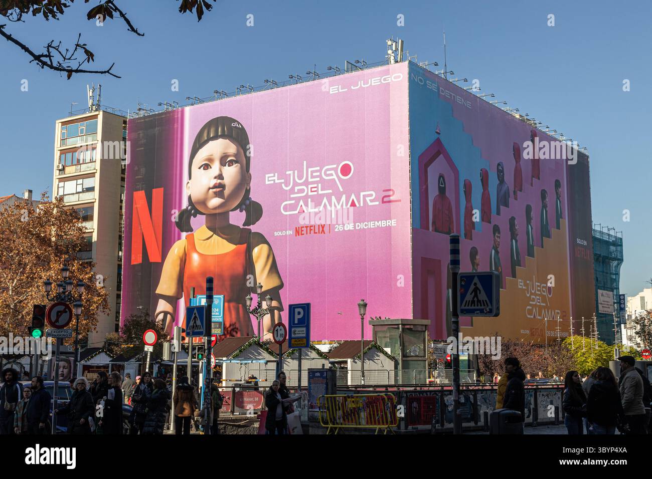 Madrid, Spain. Atocha Street building wrapped in a giant billboard ...