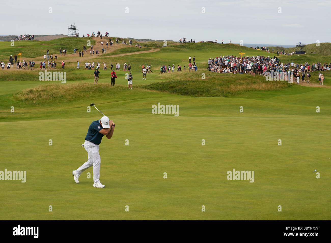 Tyrrell Hatton of England reacts after missing a put on the 9th green ...