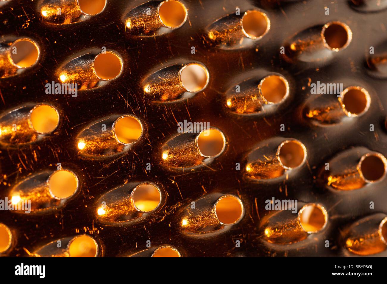 The light reflects off the metal surface, highlighting the texture and ...