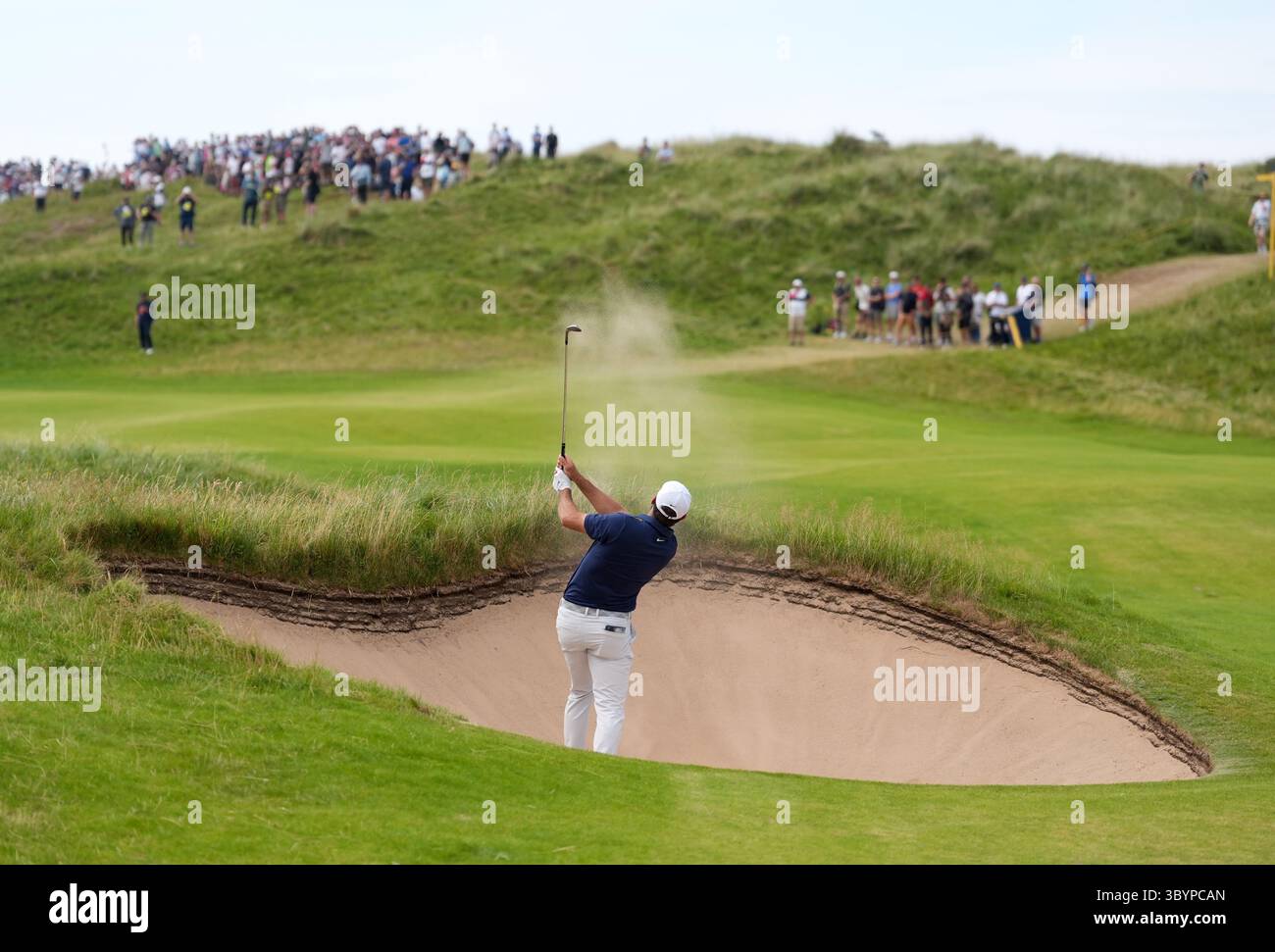 USA's Scottie Scheffler chips out of a bunker on the 7th during day ...