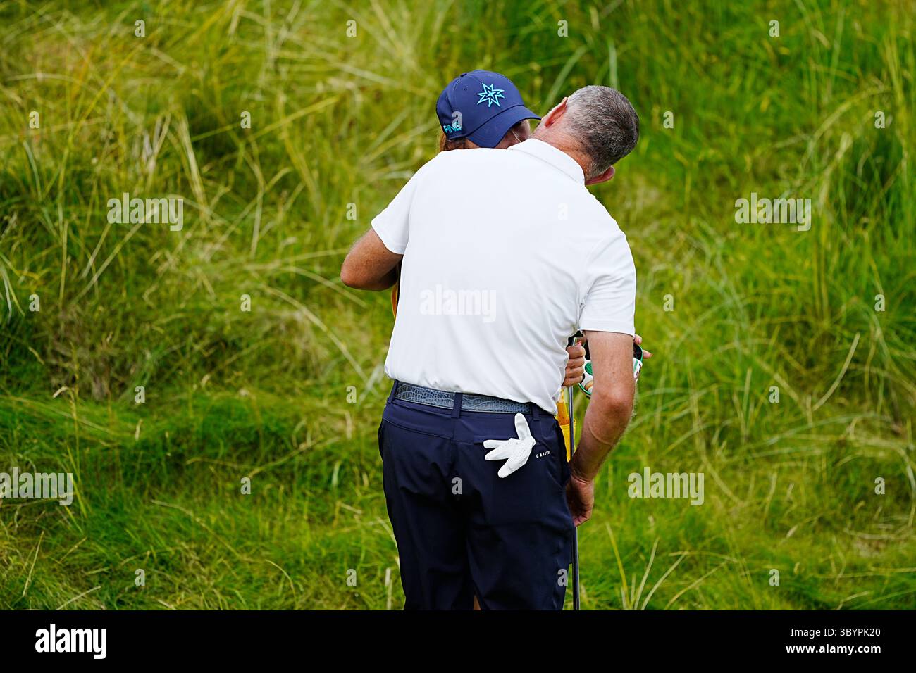 England's Lee Westwood (right) kisses wife and caddie Helen Storey on ...