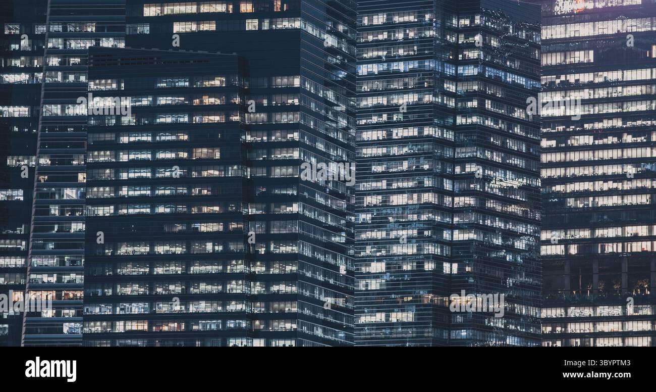 Skyscrapers windows at night in Singapore Stock Photo - Alamy