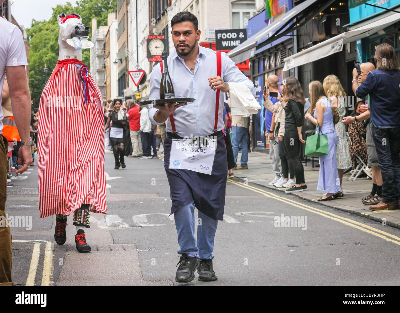 London, UK. 20th July, 2025. A morris-dancing neigh and waiter from the ...