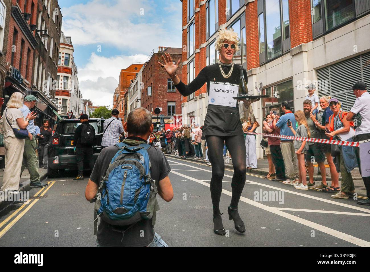 Crowds line route waiting hi-res stock photography and images - Alamy