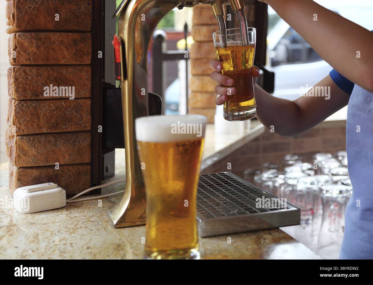 Beer on bar counter Stock Photo - Alamy