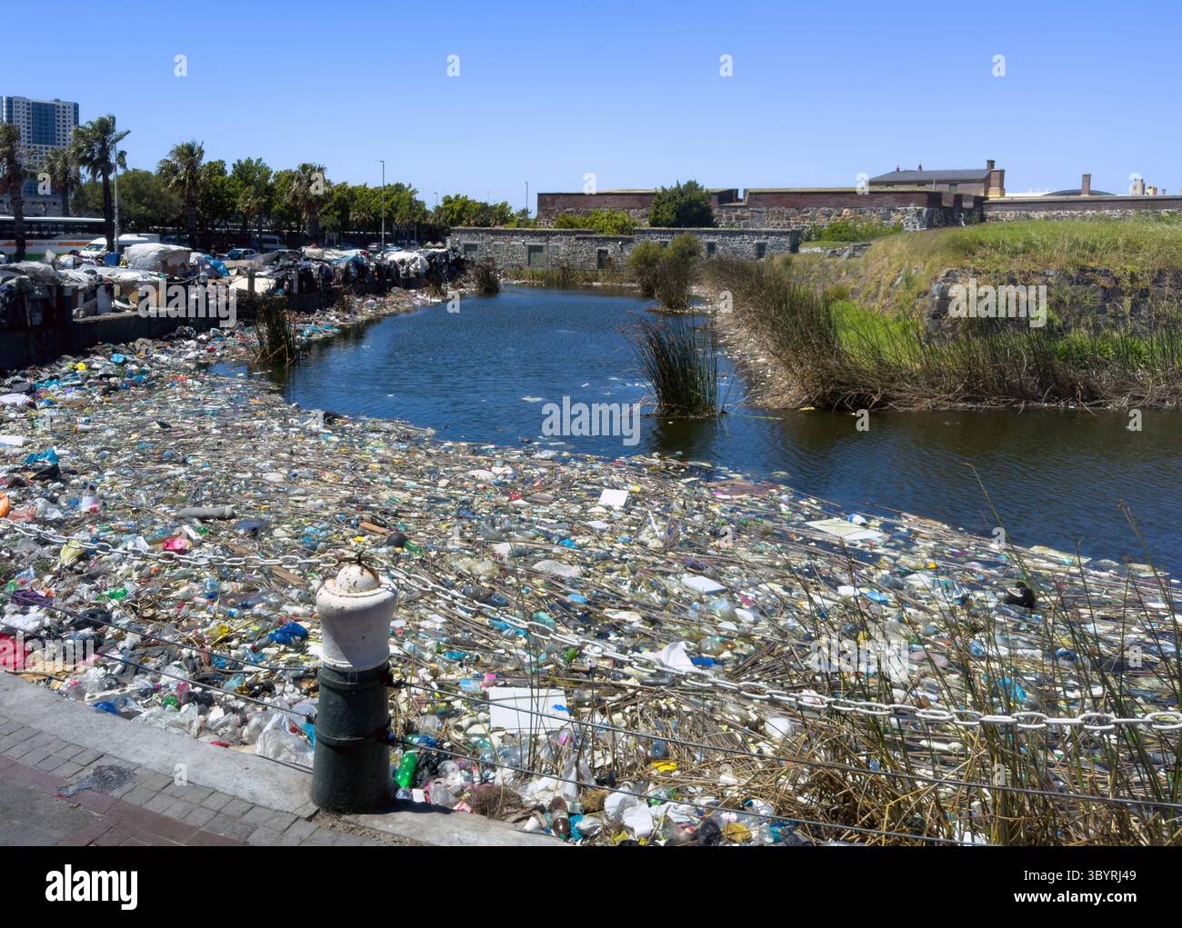 Plastic pollution in canal in Cape Town. Canal filled with plastic ...