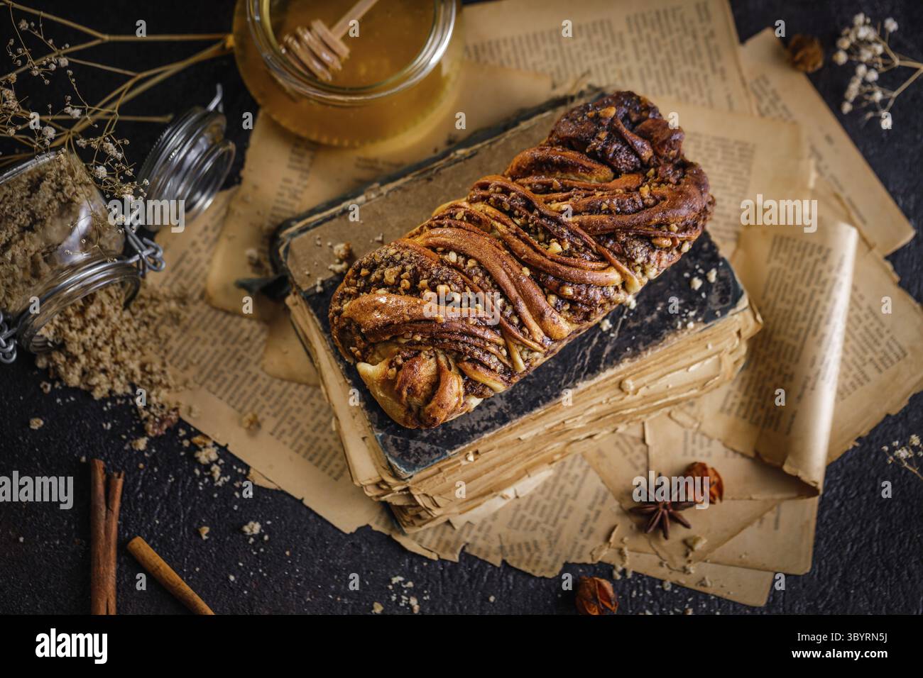 Traditional Polish babka cake with walnut. Still life of swirl brioche or walnut braided bread ...