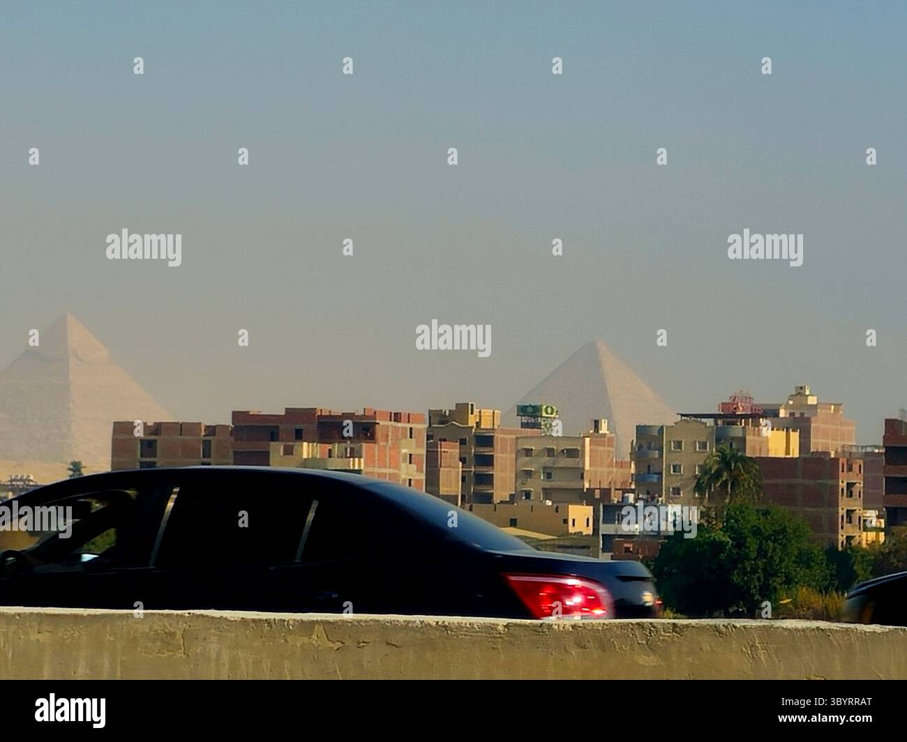 Giza, Egypt, July 6 2025: the buildings and the pyramids of Giza from ...