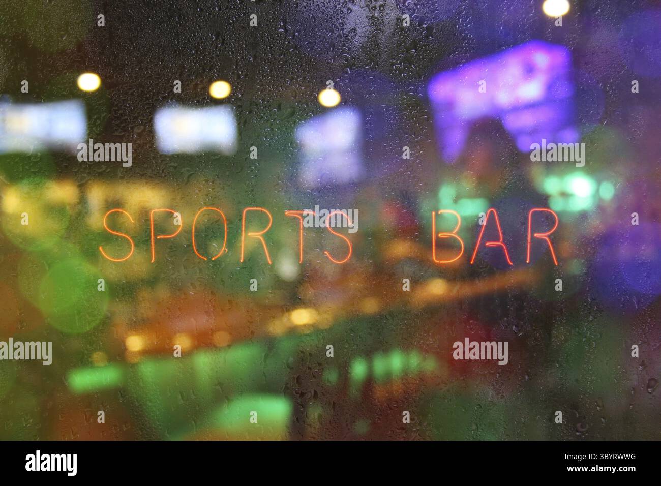 Vintage Neon Sports Bar Sign on Rainy Window with blurred background ...