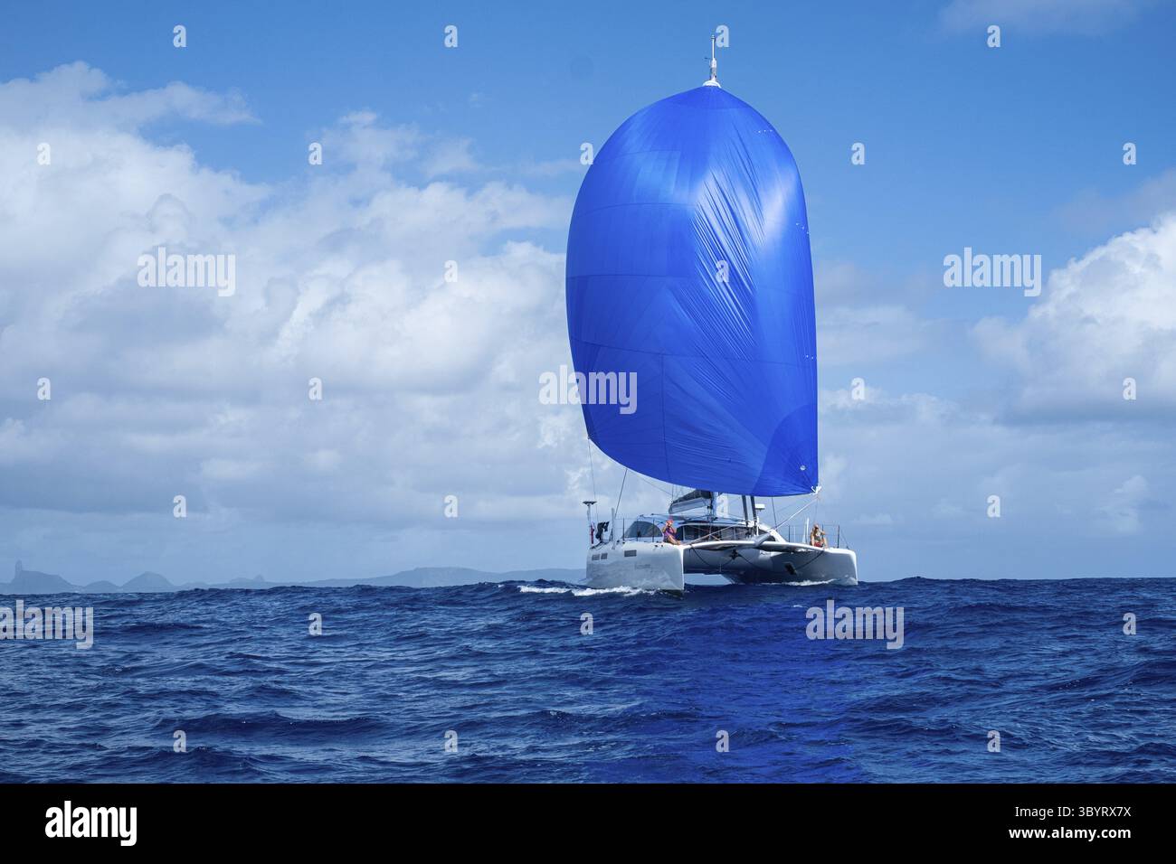 Catamaran in the South Atlantic with blue Genakker sail Stock Photo - Alamy