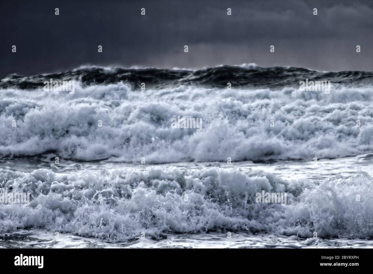 Impressive storm on Pacific coast. Wind blows spray from wave crest ...