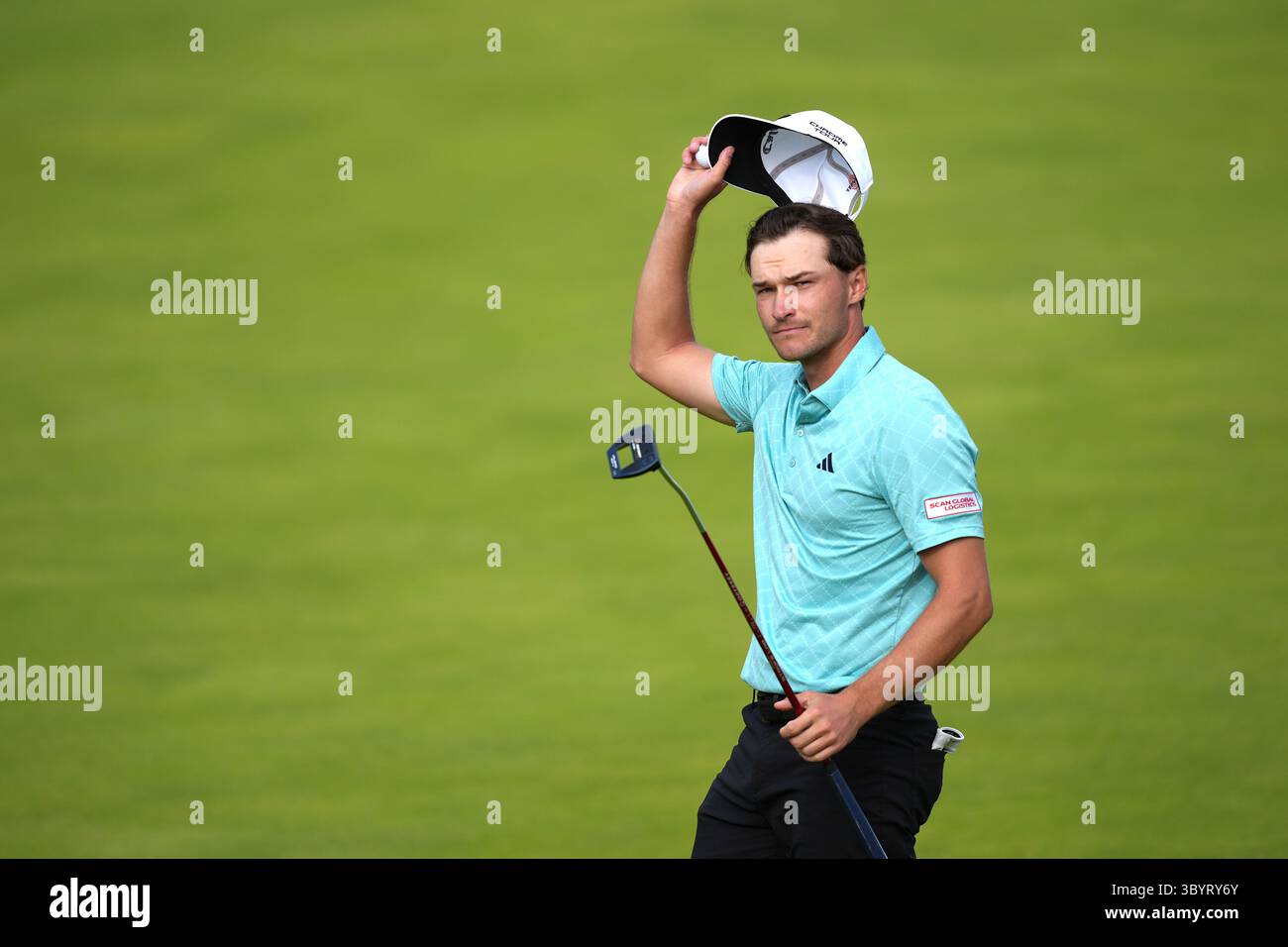 Denmark's Rasmus Hojgaard reacts on the 18th green during day four of ...