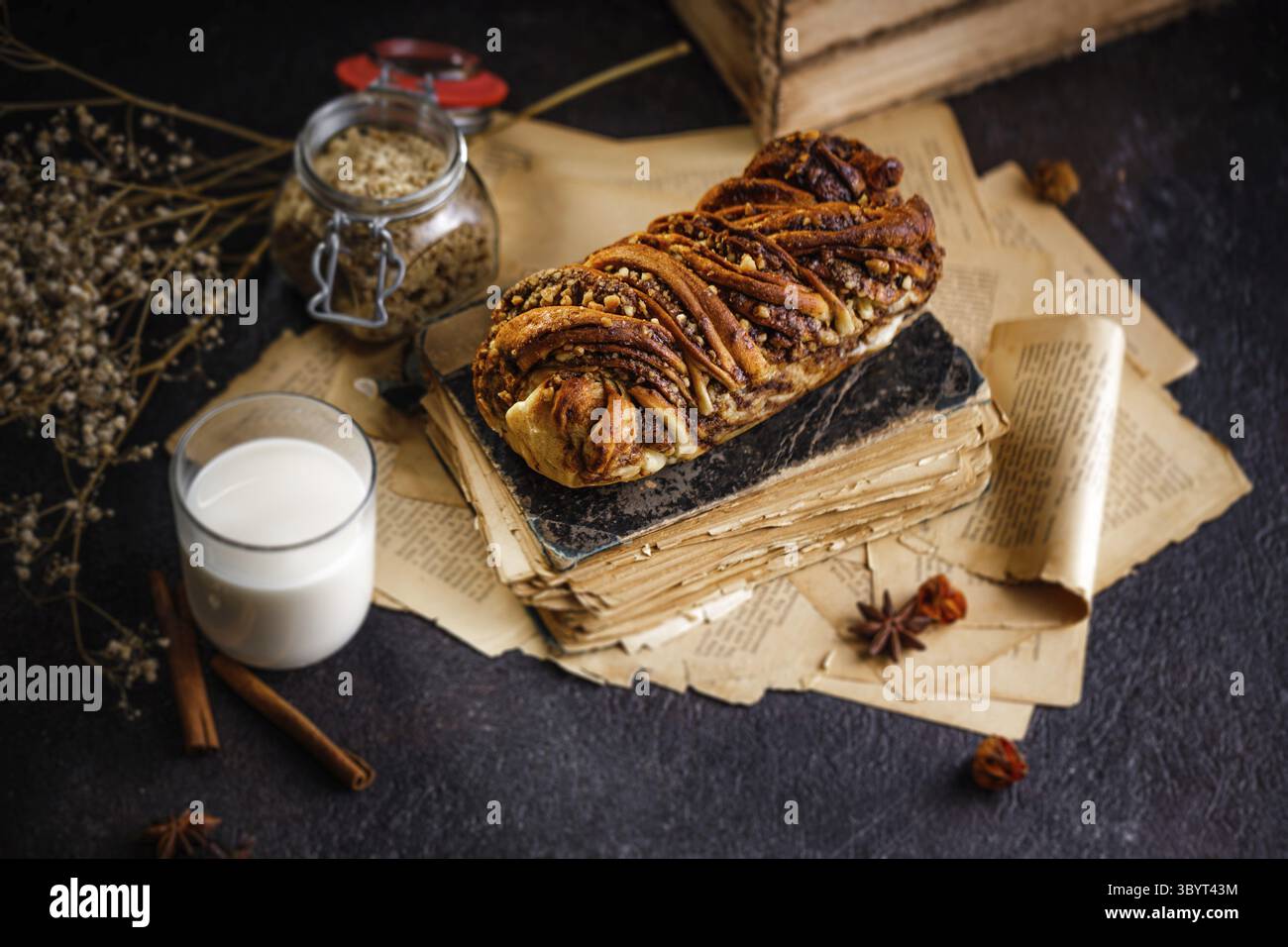 Traditional Polish babka cake with walnut. Still life of swirl brioche or walnut braided bread ...
