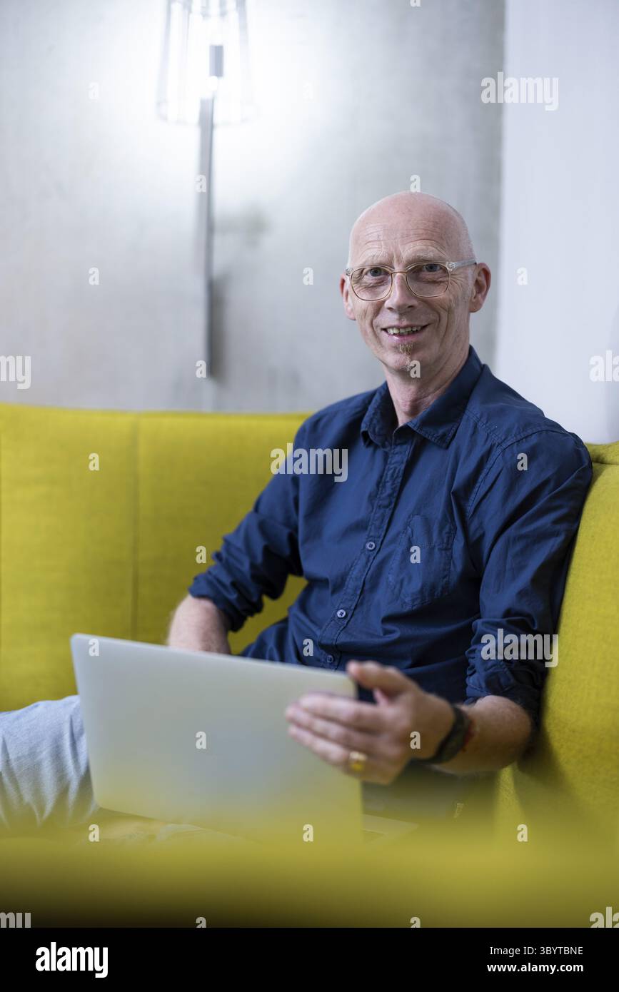 Elderly bald man in glasses hi-res stock photography and images - Alamy