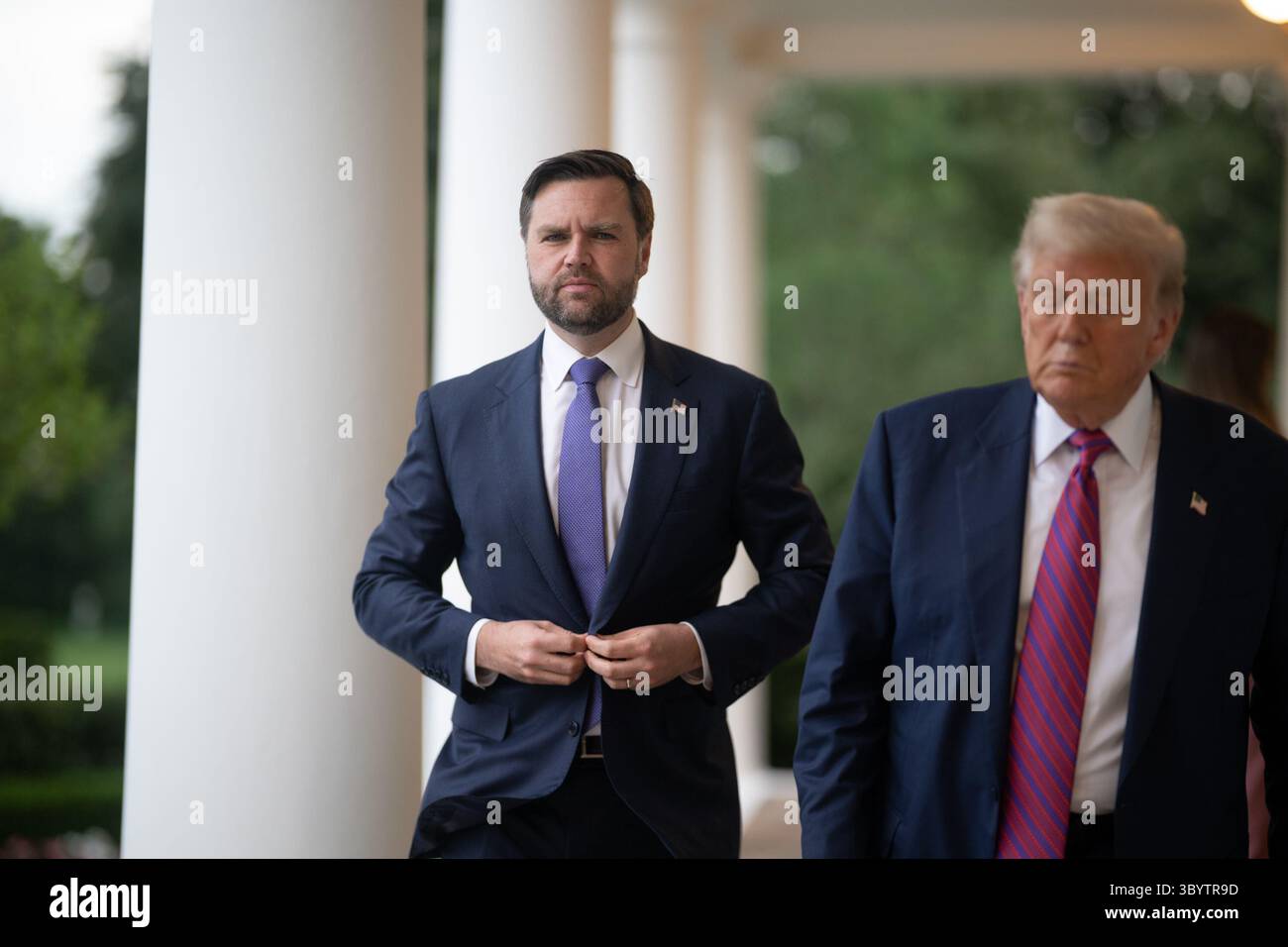 President Donald Trump and Vice President JD Vance walk along the West ...
