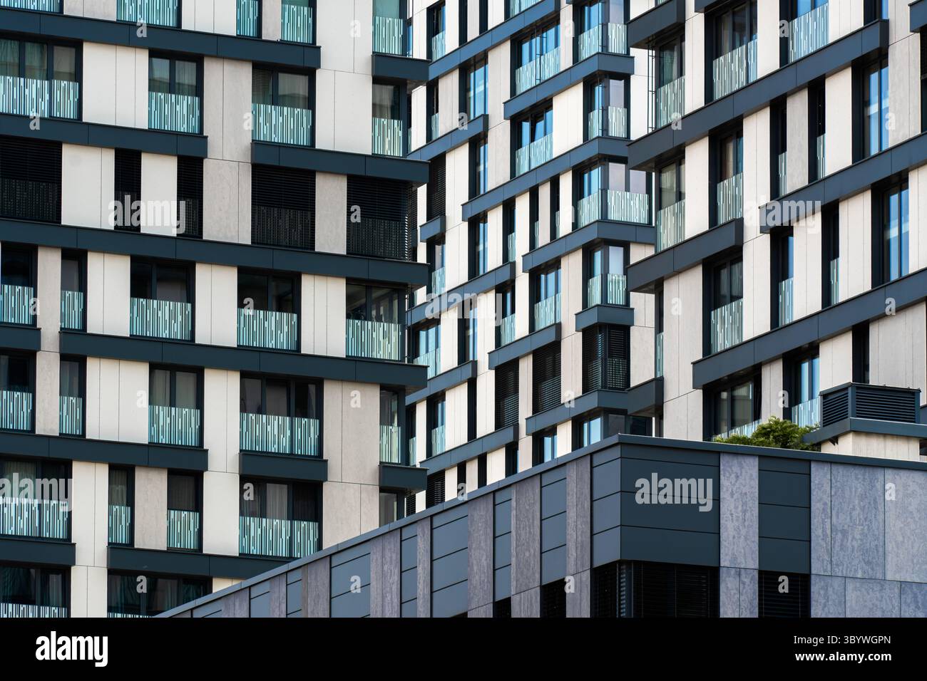 High-density residential building with white and black grid and ...