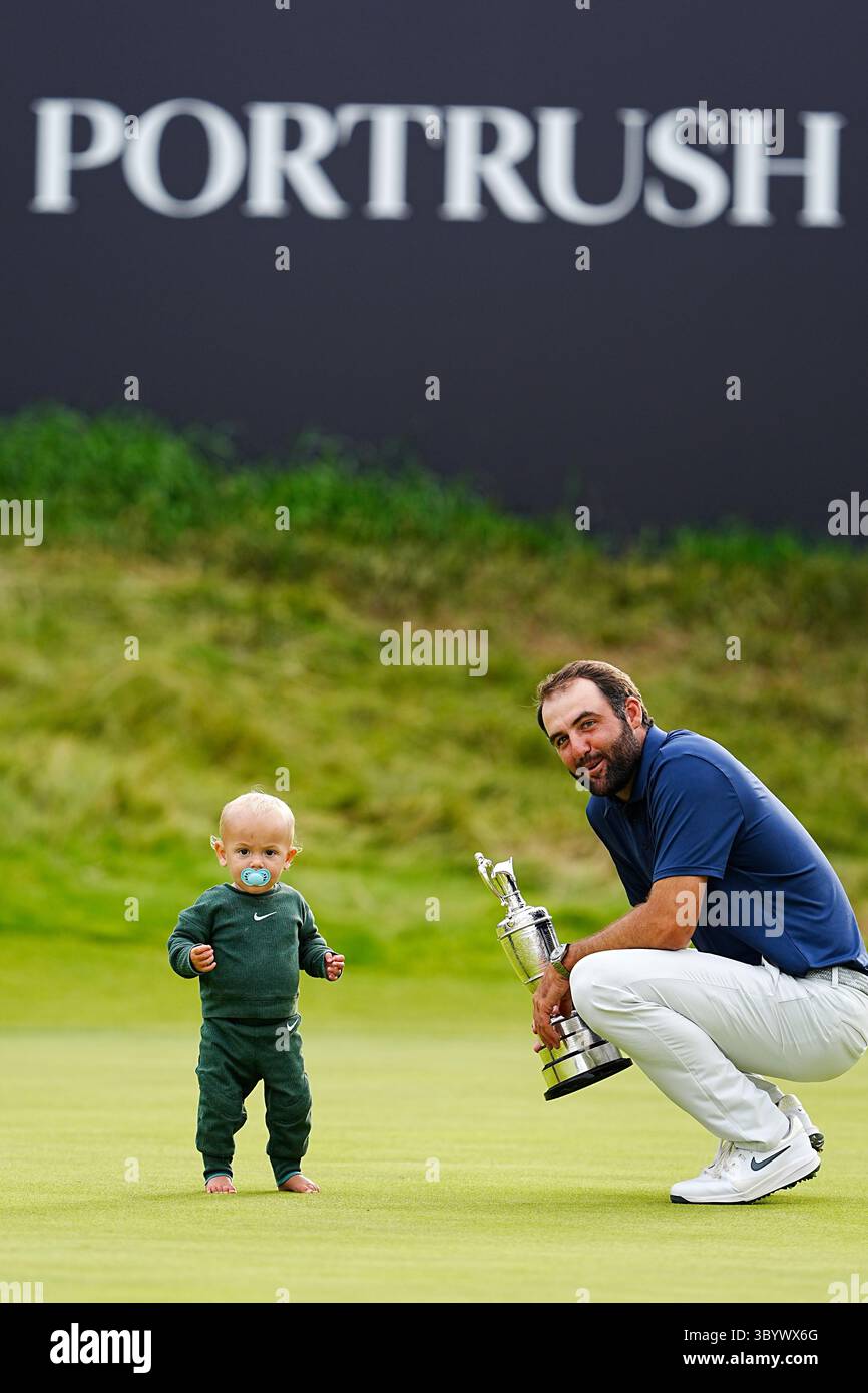 USA's Scottie Scheffler with son Bennett and the Claret Jug after ...